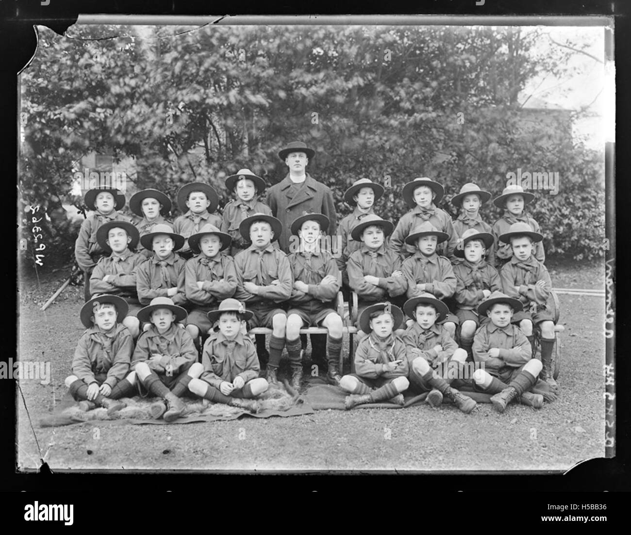 A group of Scouts is depicted, likely participating in an outdoor ...