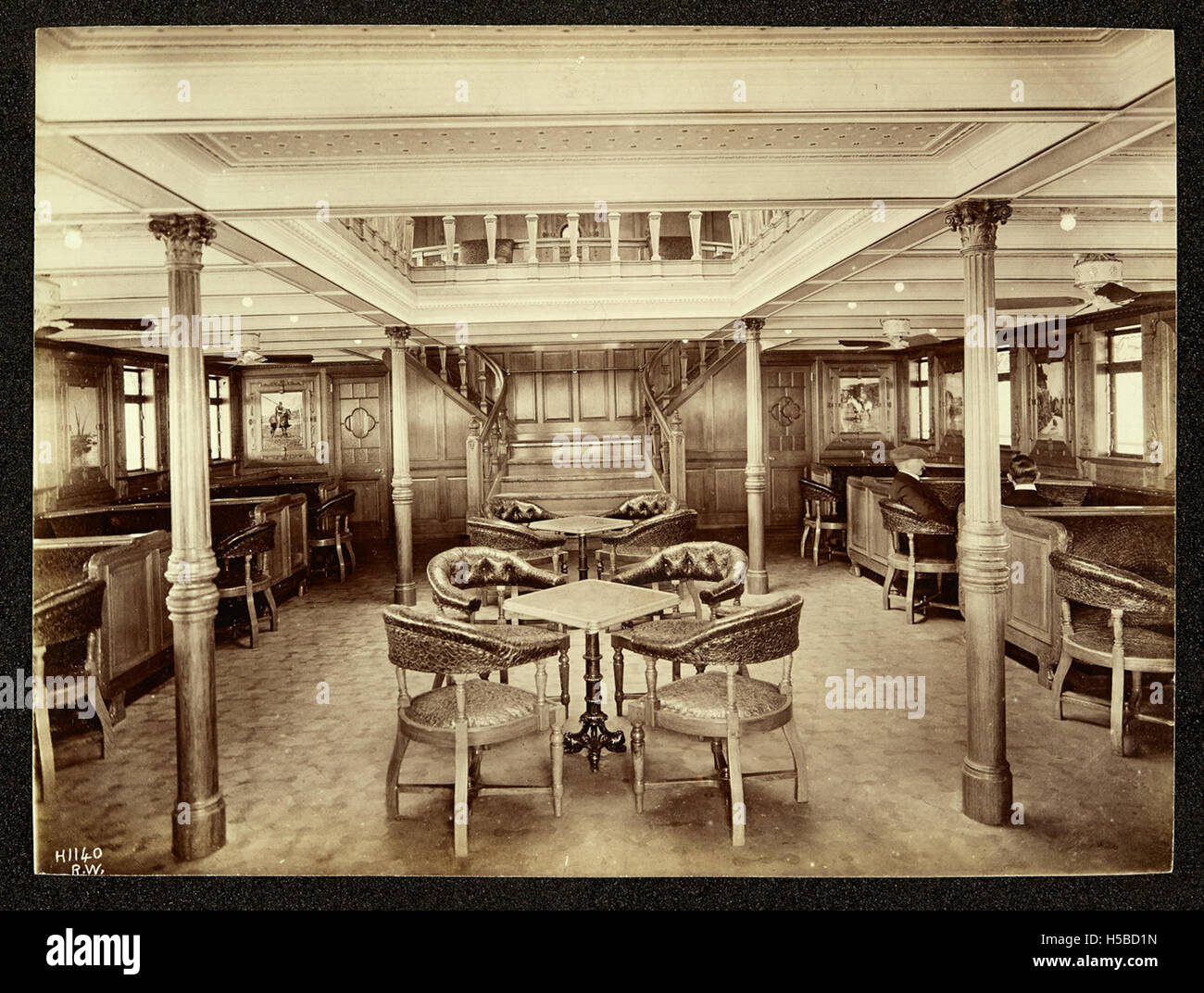 A photograph showing the interior of a ship's lounge area, offering a ...