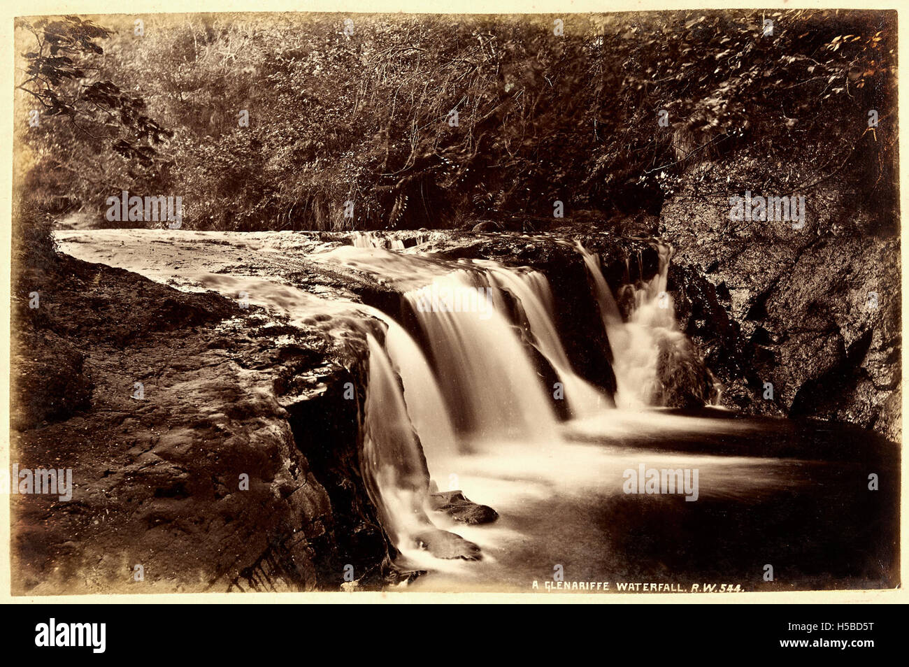 This image captures a waterfall in Glenariffe, a scenic area in ...