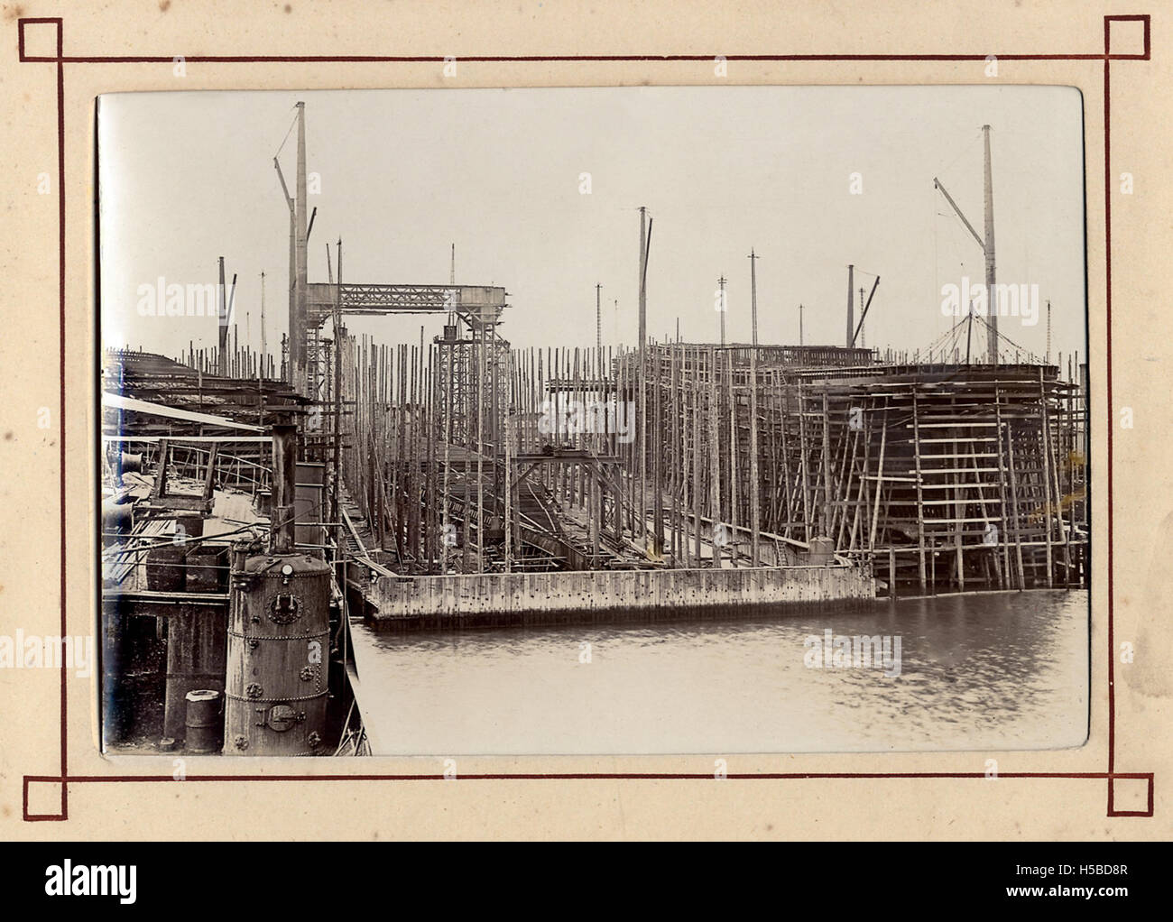 The image depicts vessels under construction at a shipyard. Shipyards ...