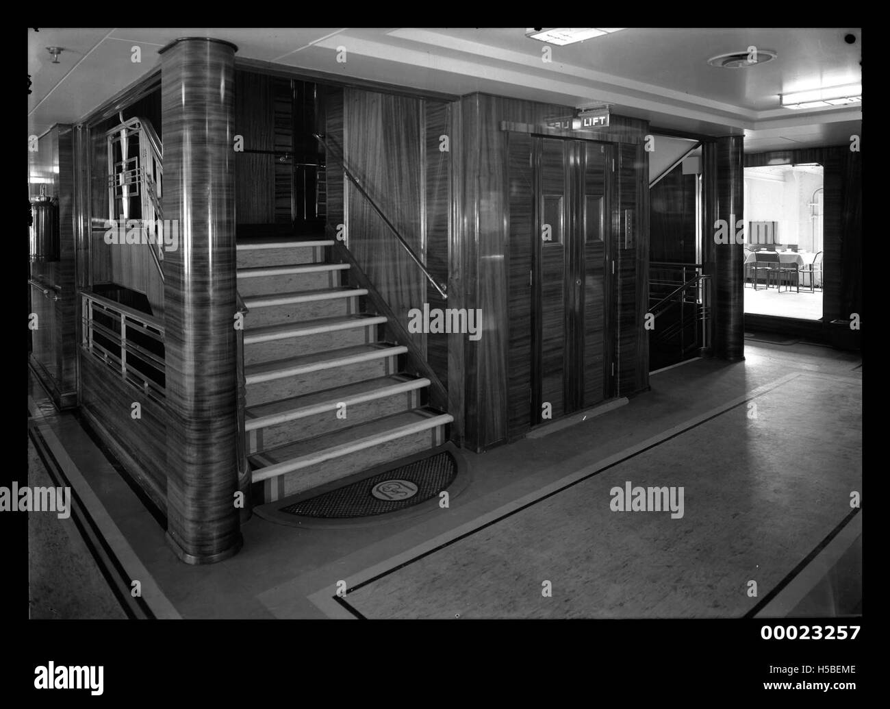 A photograph depicting the stairs and lift on the TSS AWATEA, a ship ...