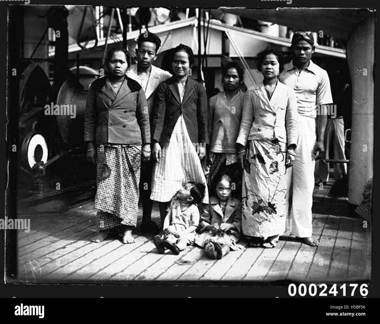 A group of Indonesian men, women, and children are seen aboard the ...