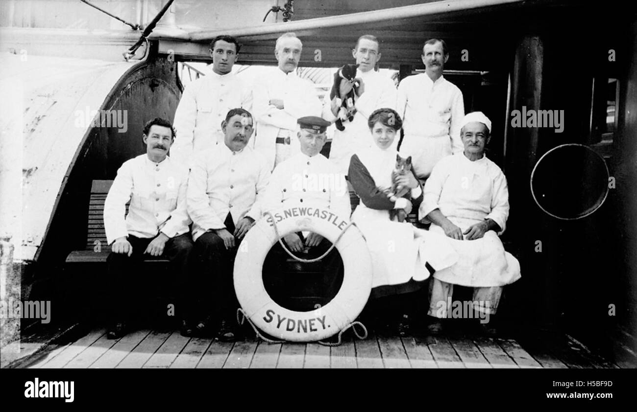 A formal crew photograph featuring the crew of a ship along with the ...