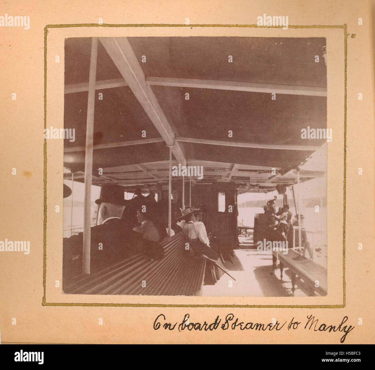 The photograph shows five passengers onboard a steamer traveling to ...