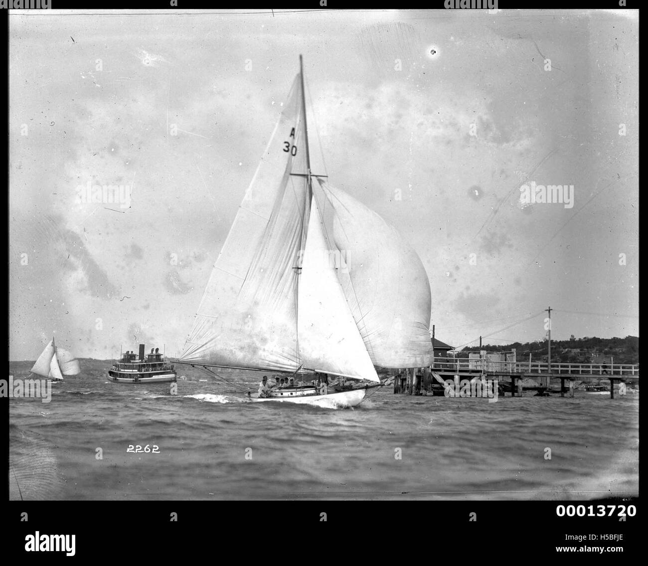 Yacht 'A30' is seen under full sail on Sydney Harbour, taking part in a ...