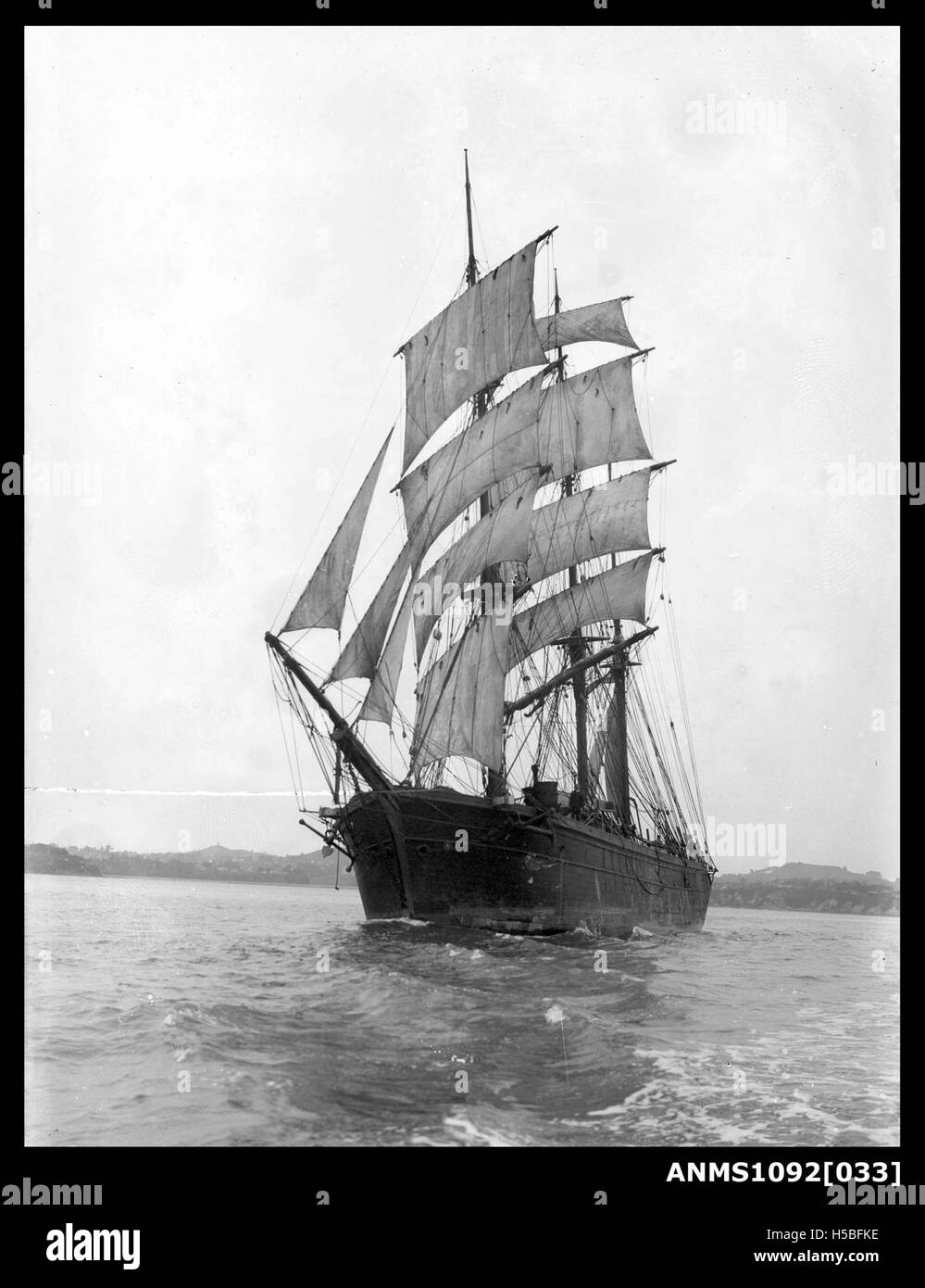 A three-masted barque, possibly named NOTERO, is seen underway with its ...