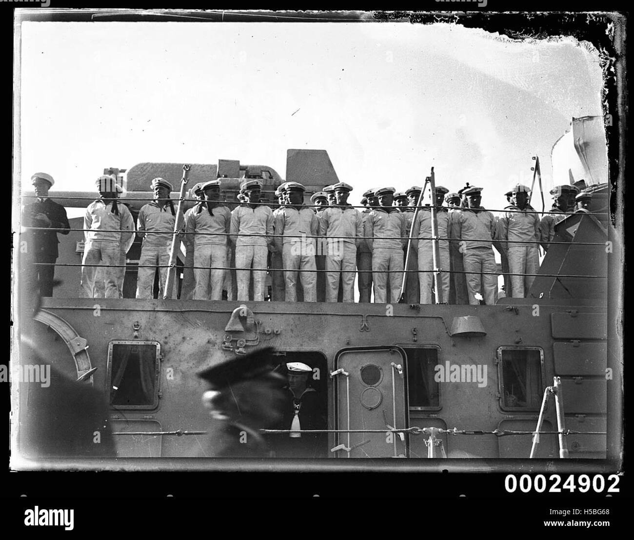 German seamen are shown standing at ease on the deck of the KOLN, a ...