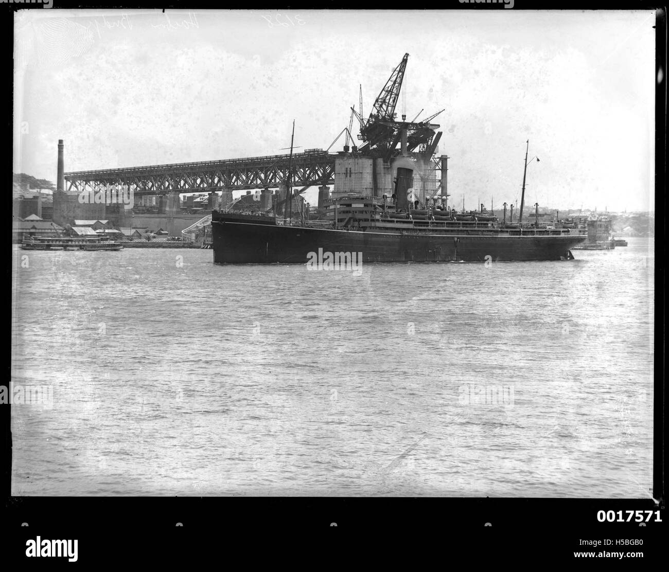 The SS Mongolia is seen underway, with the iconic Sydney Harbour Bridge ...