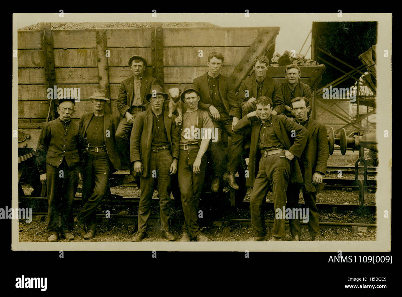 Photographic postcard of a group of ten male rail workers Stock Photo ...