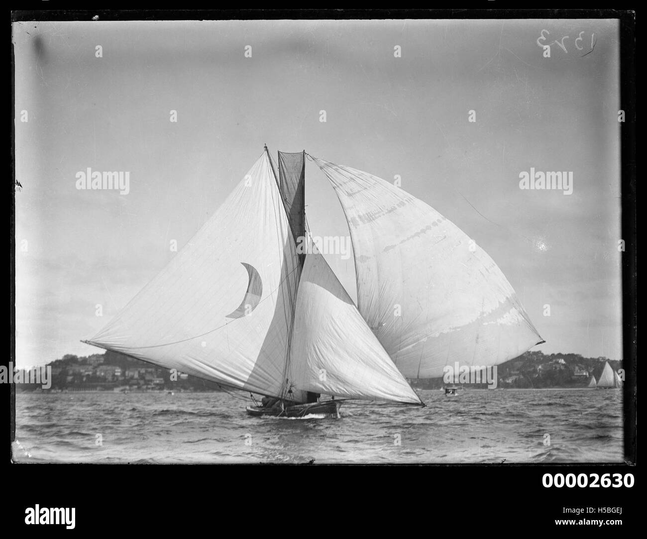 A yacht is seen under sail on Sydney Harbour, one of the world’s most ...