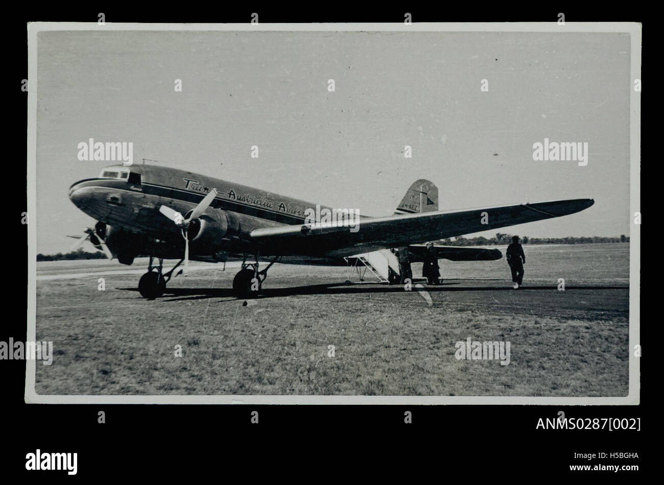 This image shows a plane waiting to transport migrants to Woomera ...