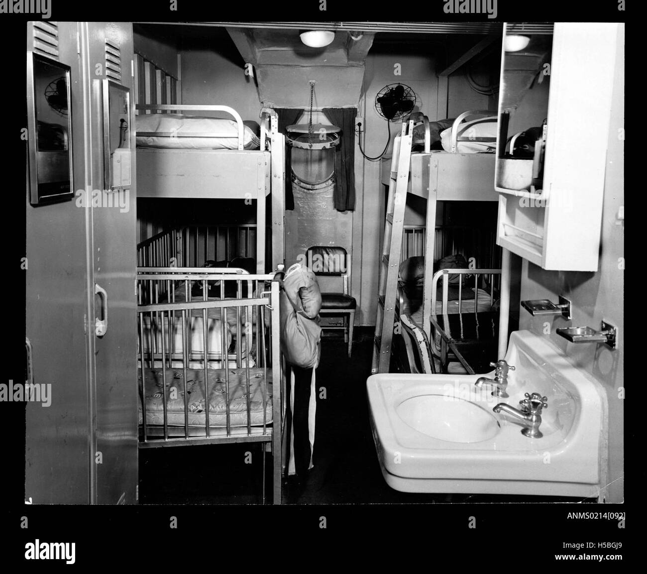 This image depicts the interior of a four-berth cabin aboard a migrant ...