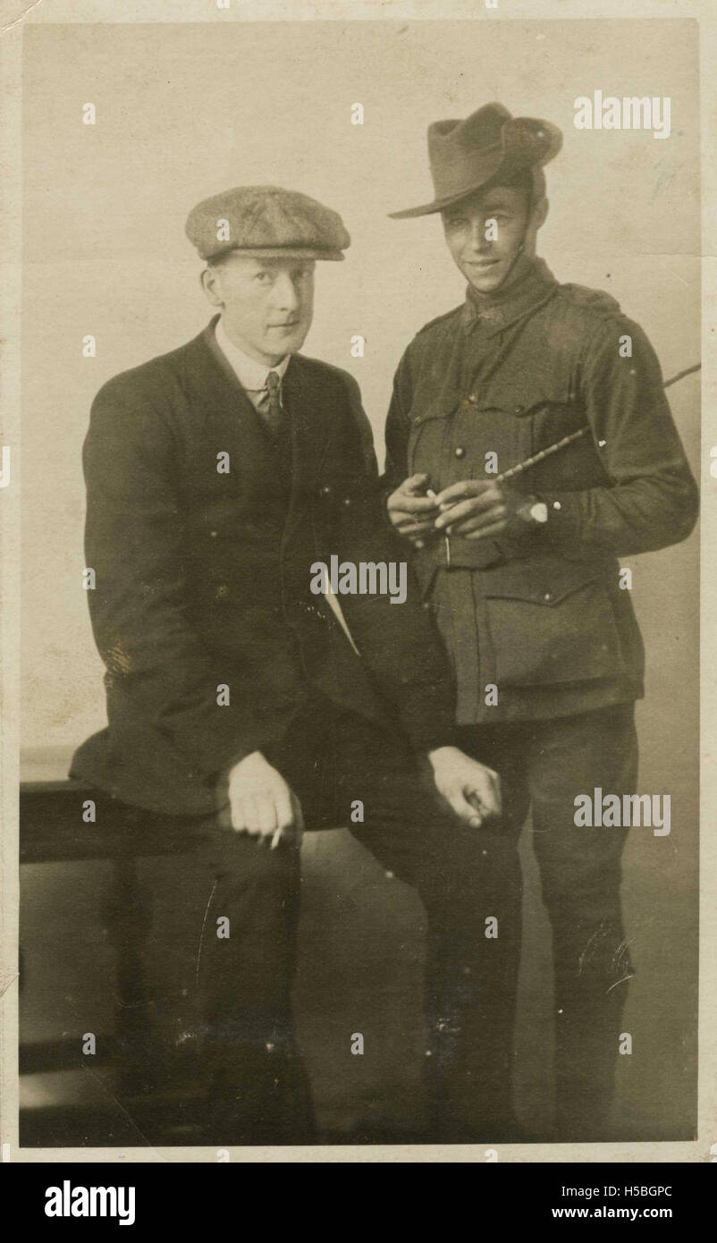 The photograph shows Charles Kerr (on the right) with an unidentified ...
