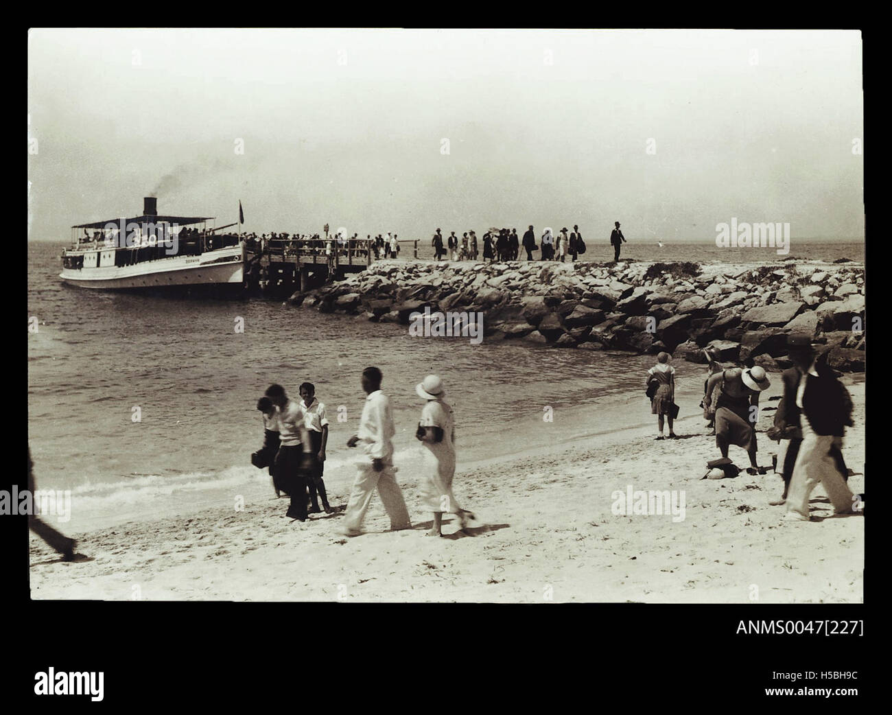 Passengers disembark from the SS Zephyer, a ship that likely docked at ...