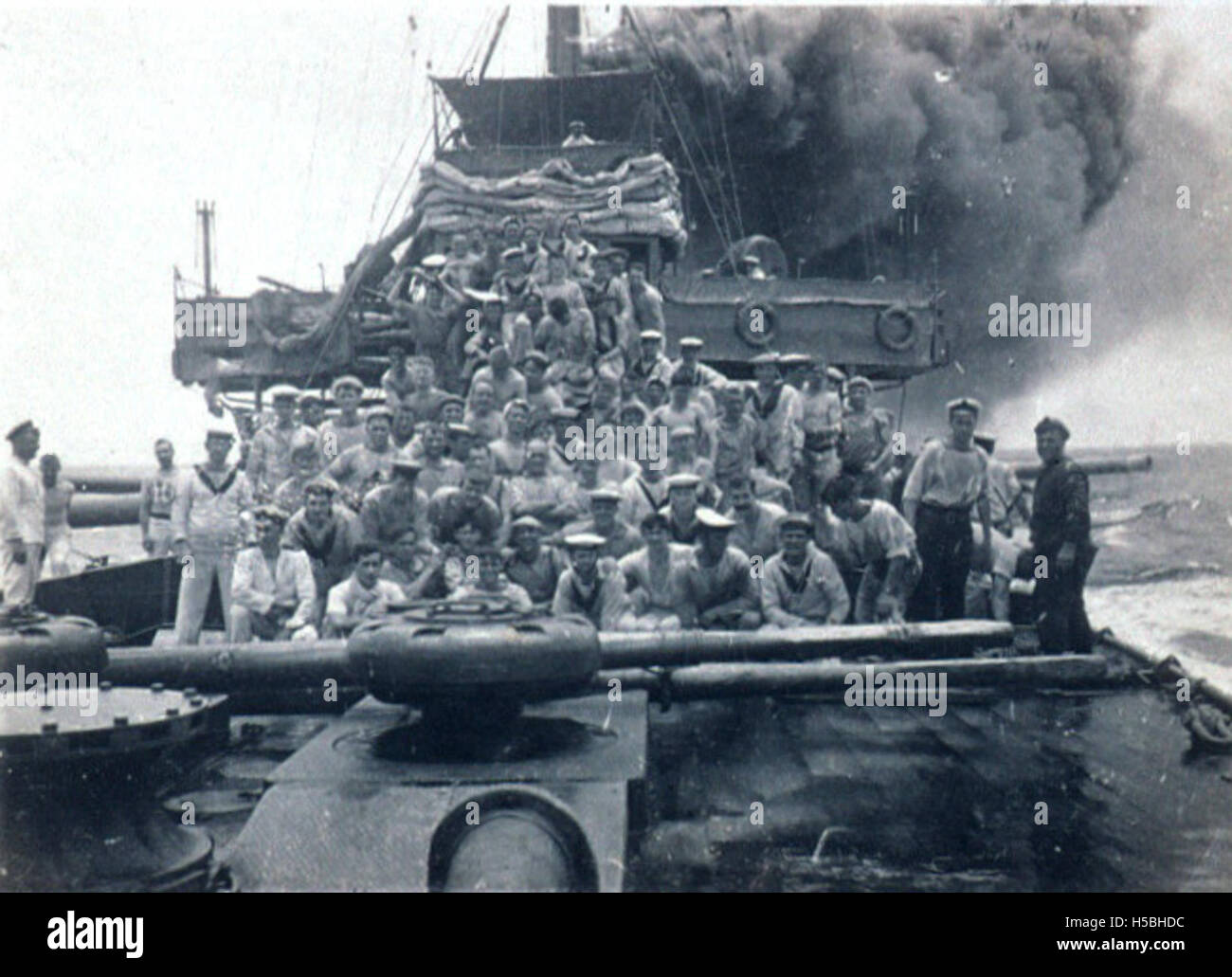 This photograph captures four crew members of the HMAS Sydney posing ...