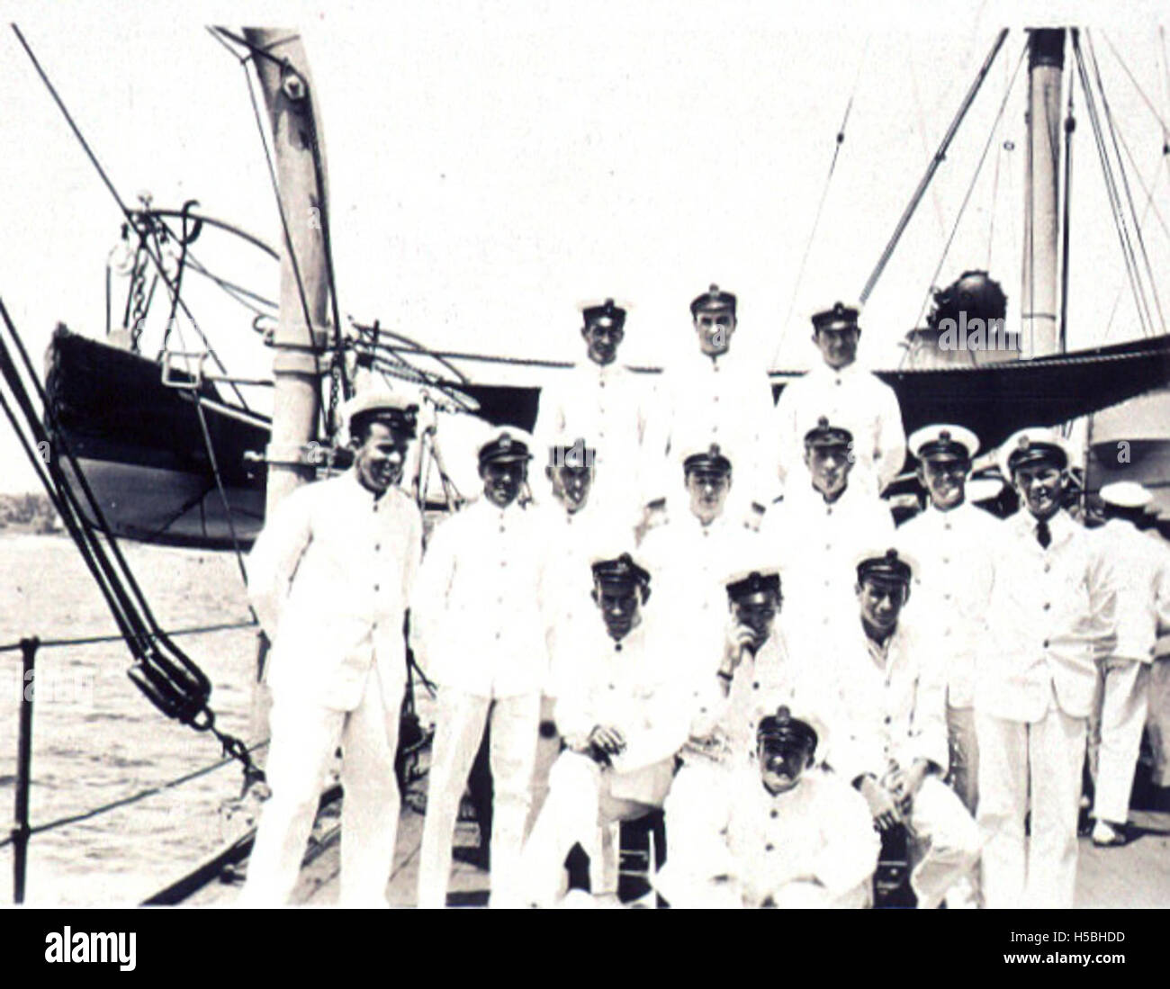 A group of officers from the HMAS Sydney are pictured, representing the ...