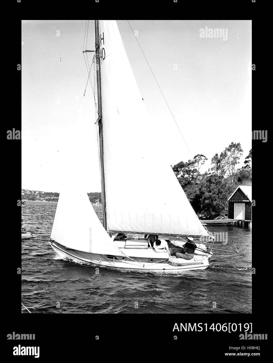 2 Yacht underway, seen from portside, with a five person crew Stock ...