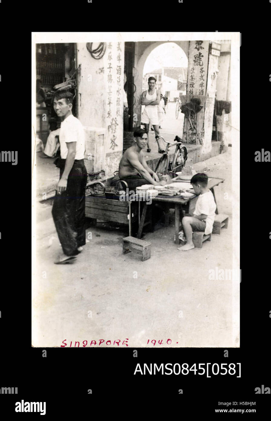 A photograph taken outside a shop in Singapore in 1940 shows a bustling ...