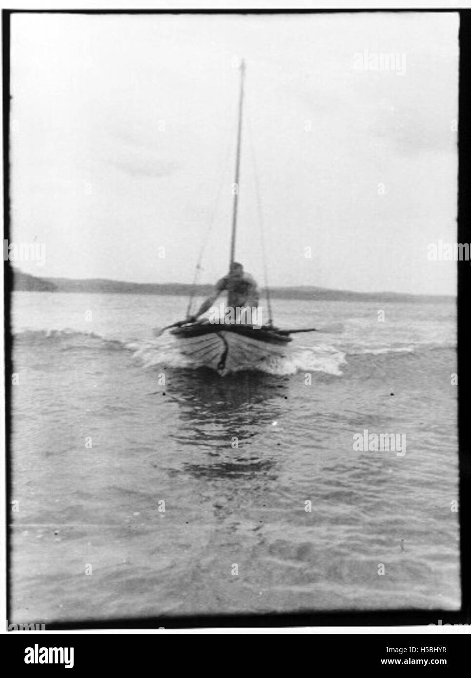 A person is shown catching a wave while riding a dinghy, highlighting ...