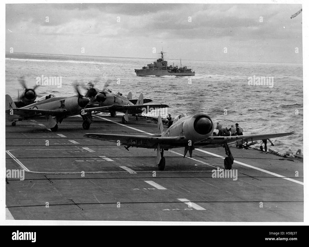 Seaplanes are seen aboard the aircraft carrier HMAS Sydney ...
