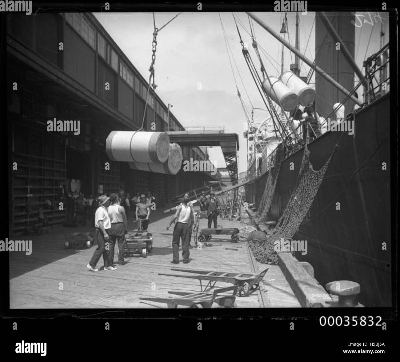 This photograph depicts an unknown vessel unloading cargo at Jones Bay ...