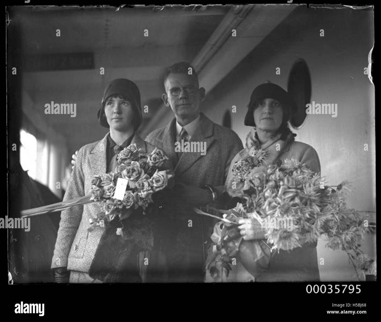 A photograph from around 1927 showing three passengers aboard the SS ...