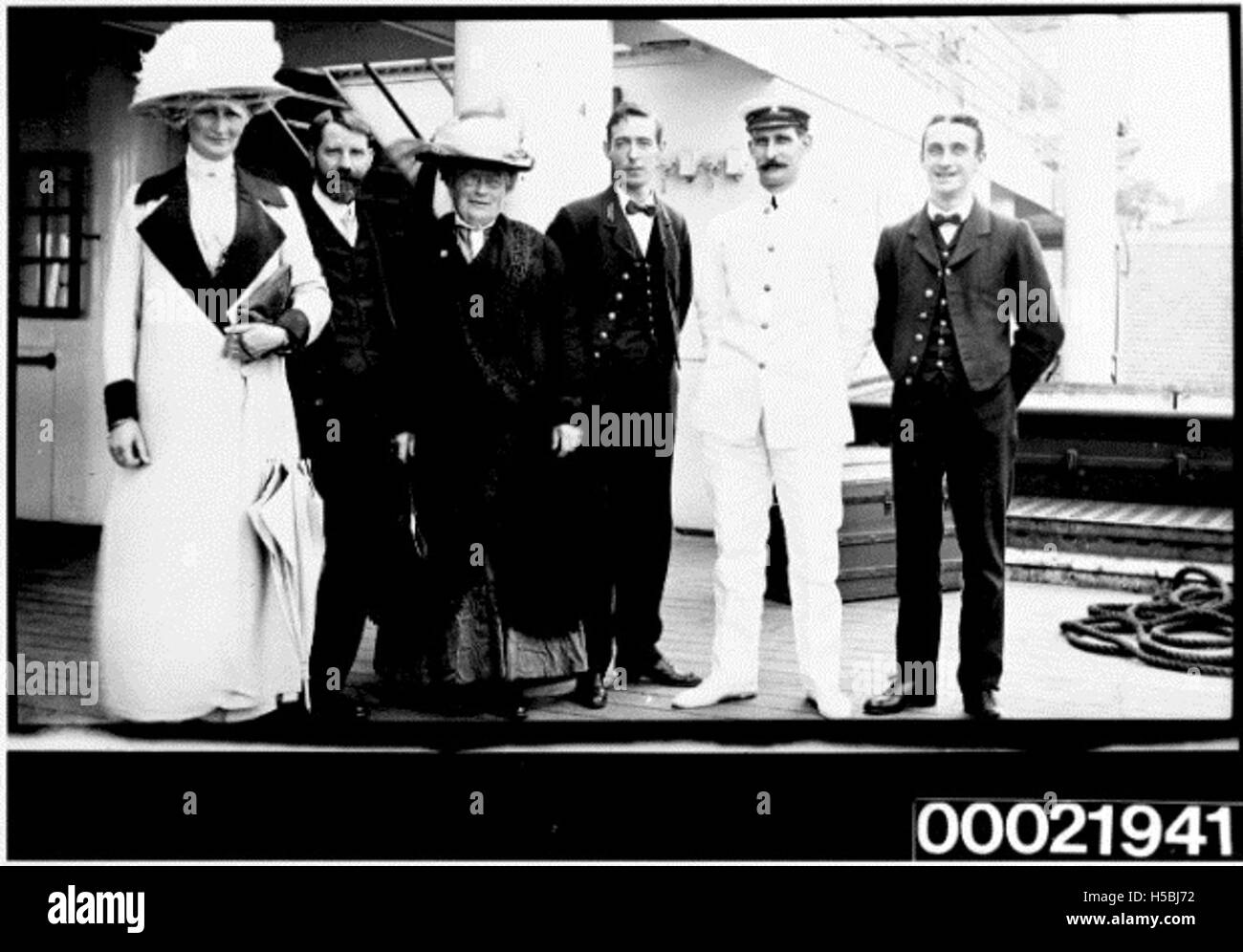 A group portrait captured on board a White Star Line vessel, likely ...