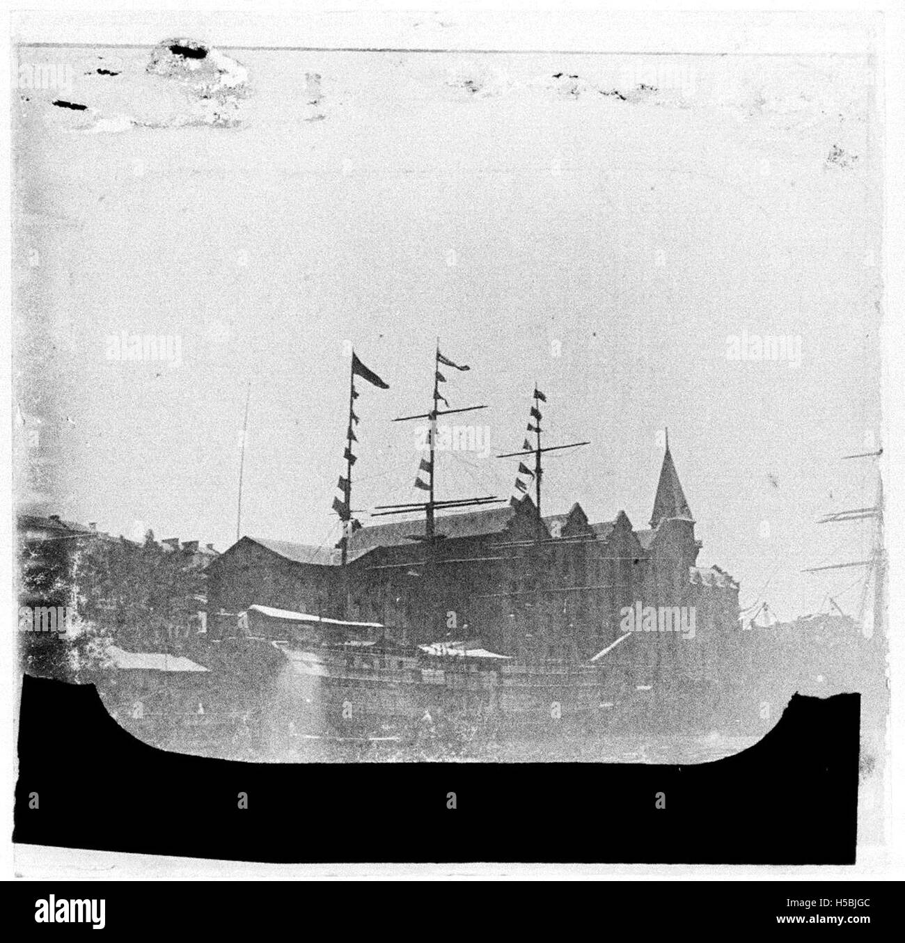 The HMS Success, a British naval ship, is decked with flags for a ...