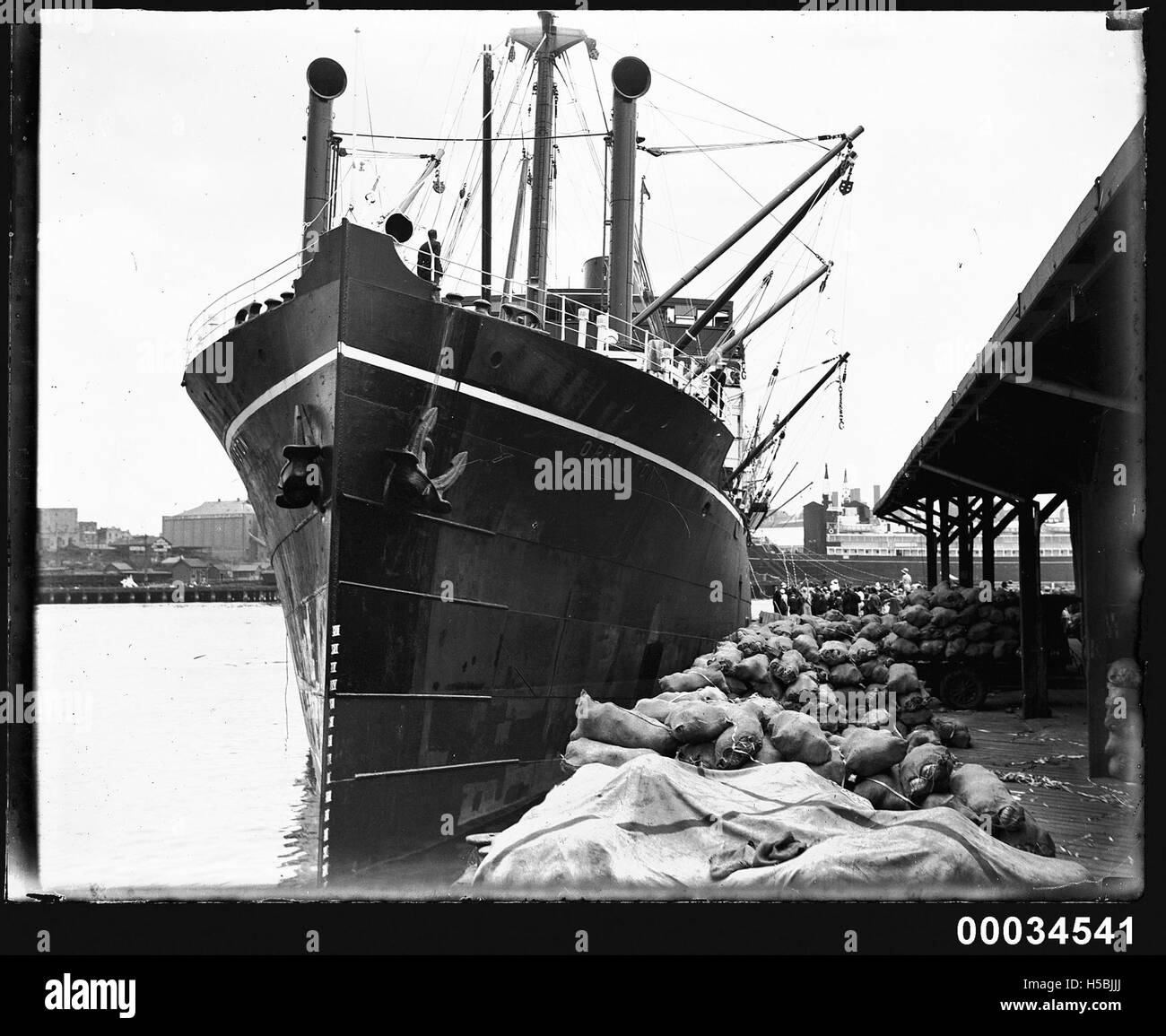 The SS Ormiston, a passenger ship, is about to depart from a wharf ...