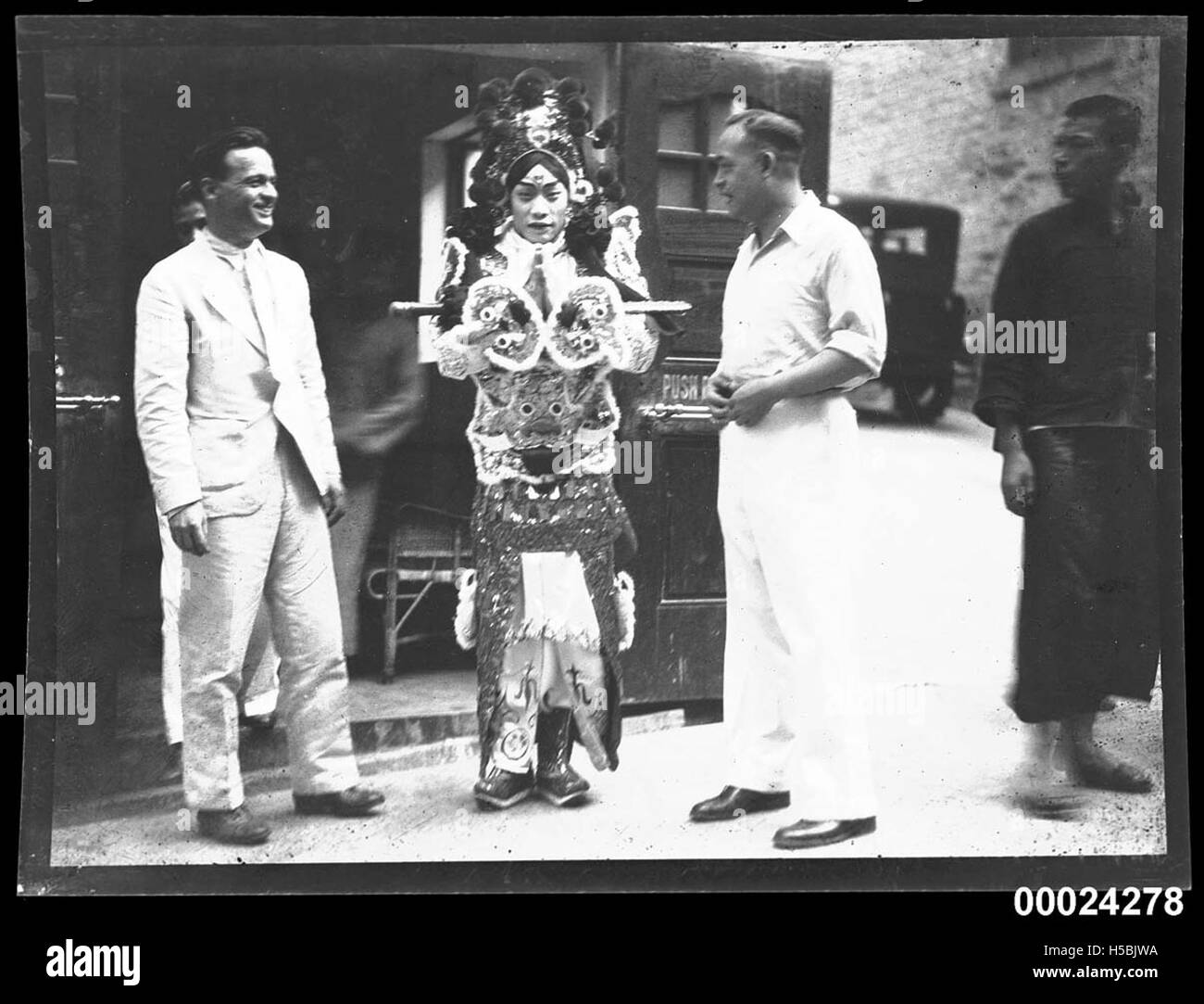 An image depicting a Japanese man dressed in elaborate traditional ...