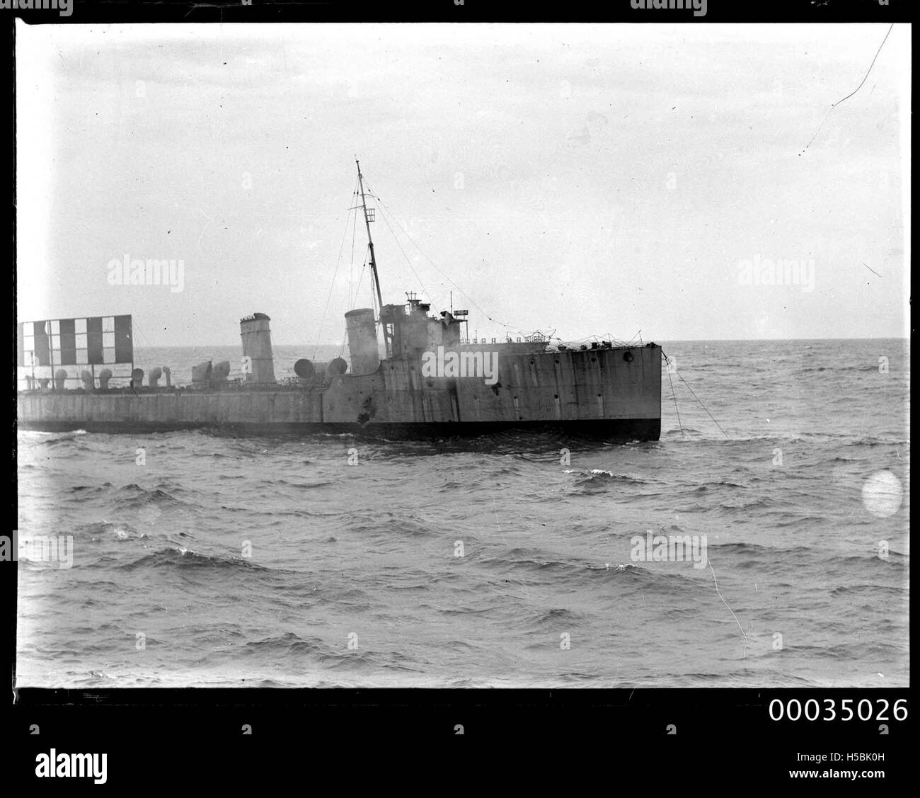 This image depicts the scuttling of HMAS Torrens, part of the Hood ...