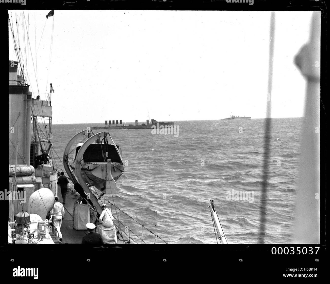 This photograph captures the sinking of the HMAS Torrens, part of the ...