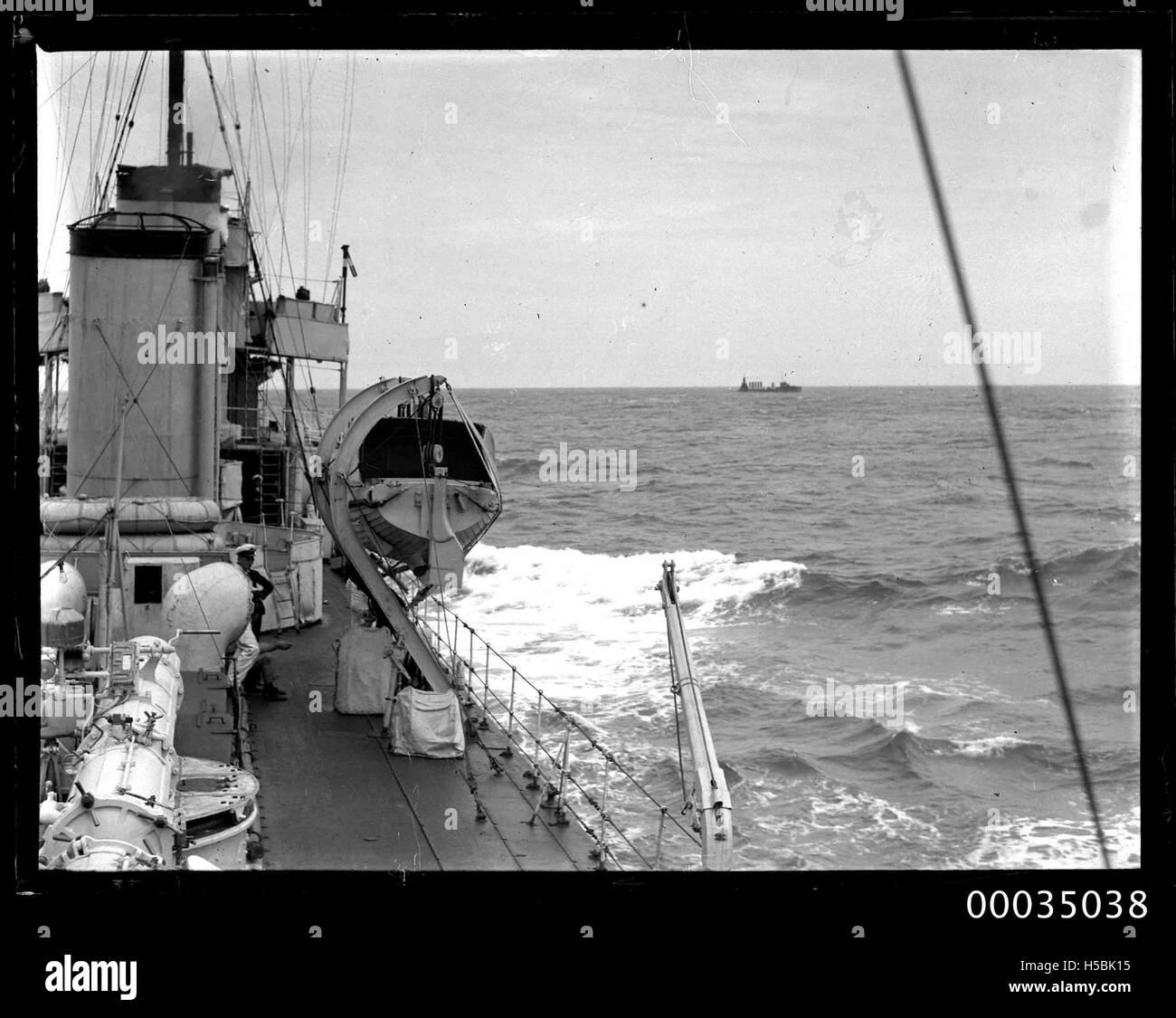This image depicts the sinking of HMAS Torrens, captured from the I ...