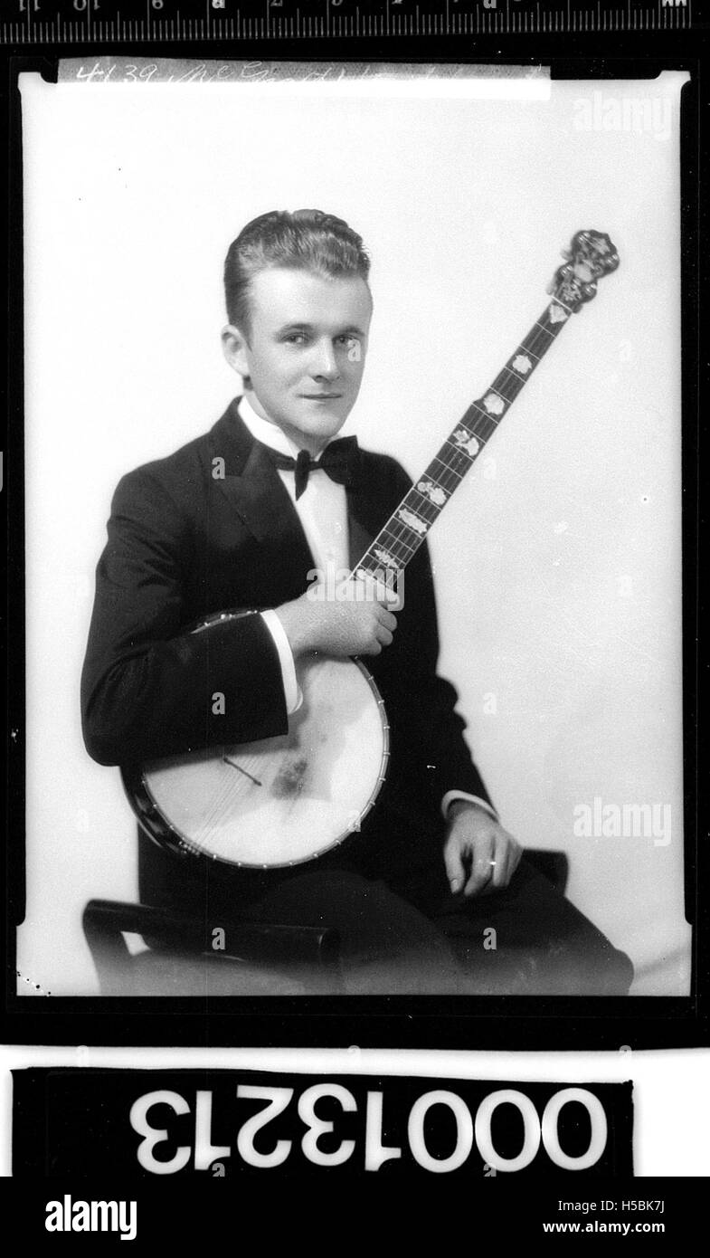 Portrait of a man holding a banjo Stock Photo - Alamy