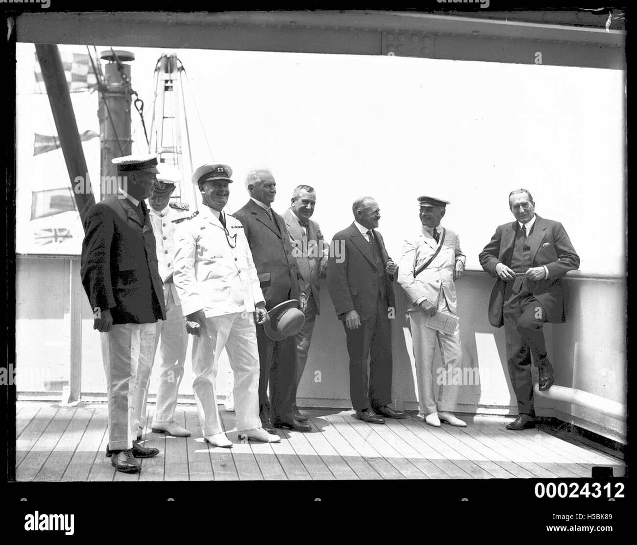 This image features a group portrait with eight men aboard the RMS ...