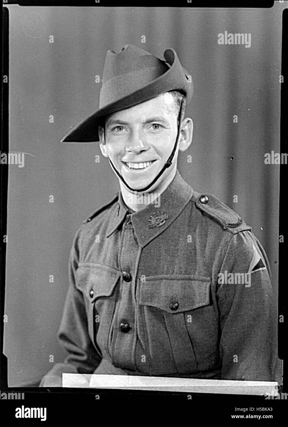 This image is a portrait of a soldier, captured in uniform, likely from ...