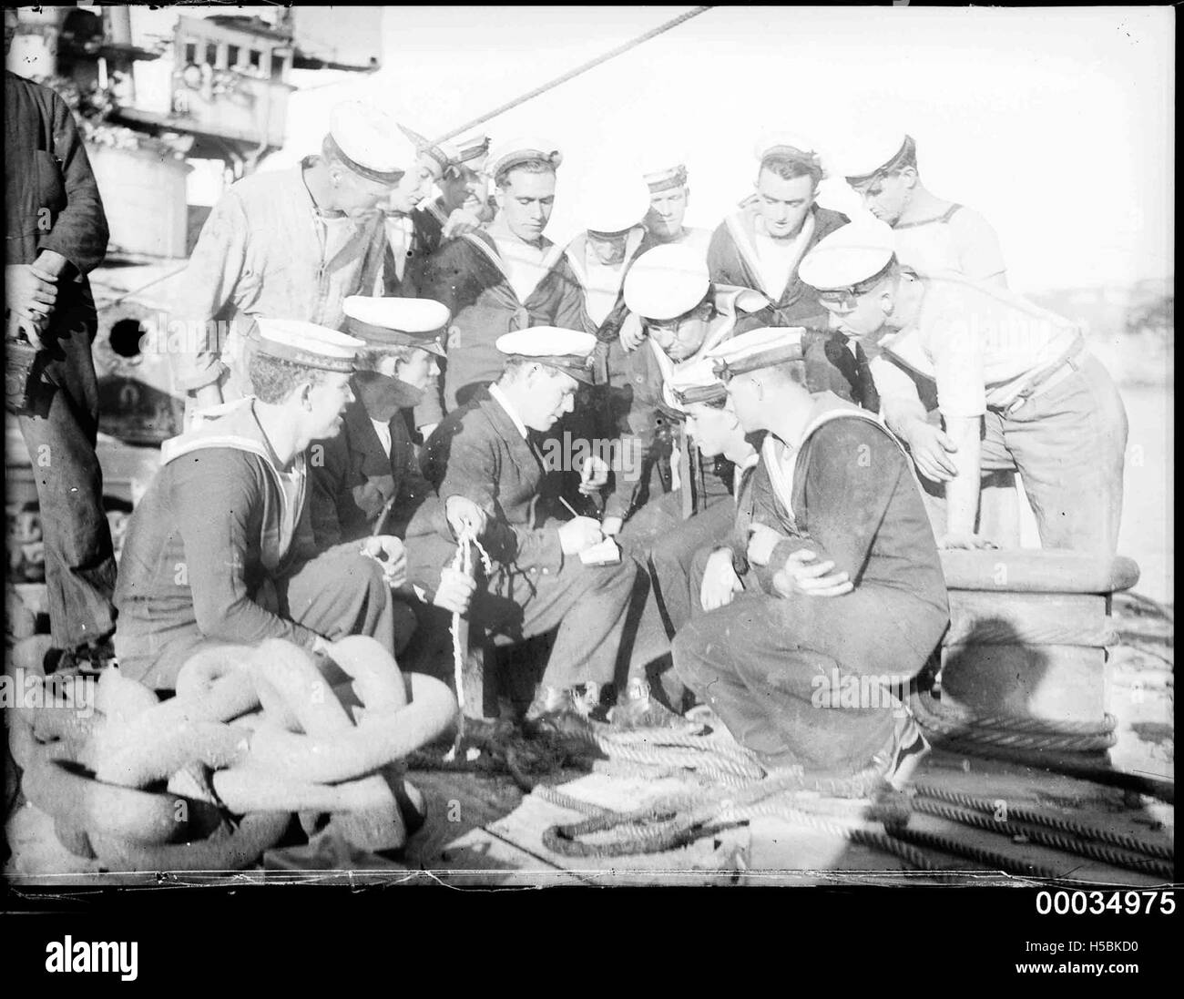 This image shows sailors handling demolition charges aboard HMAS ...