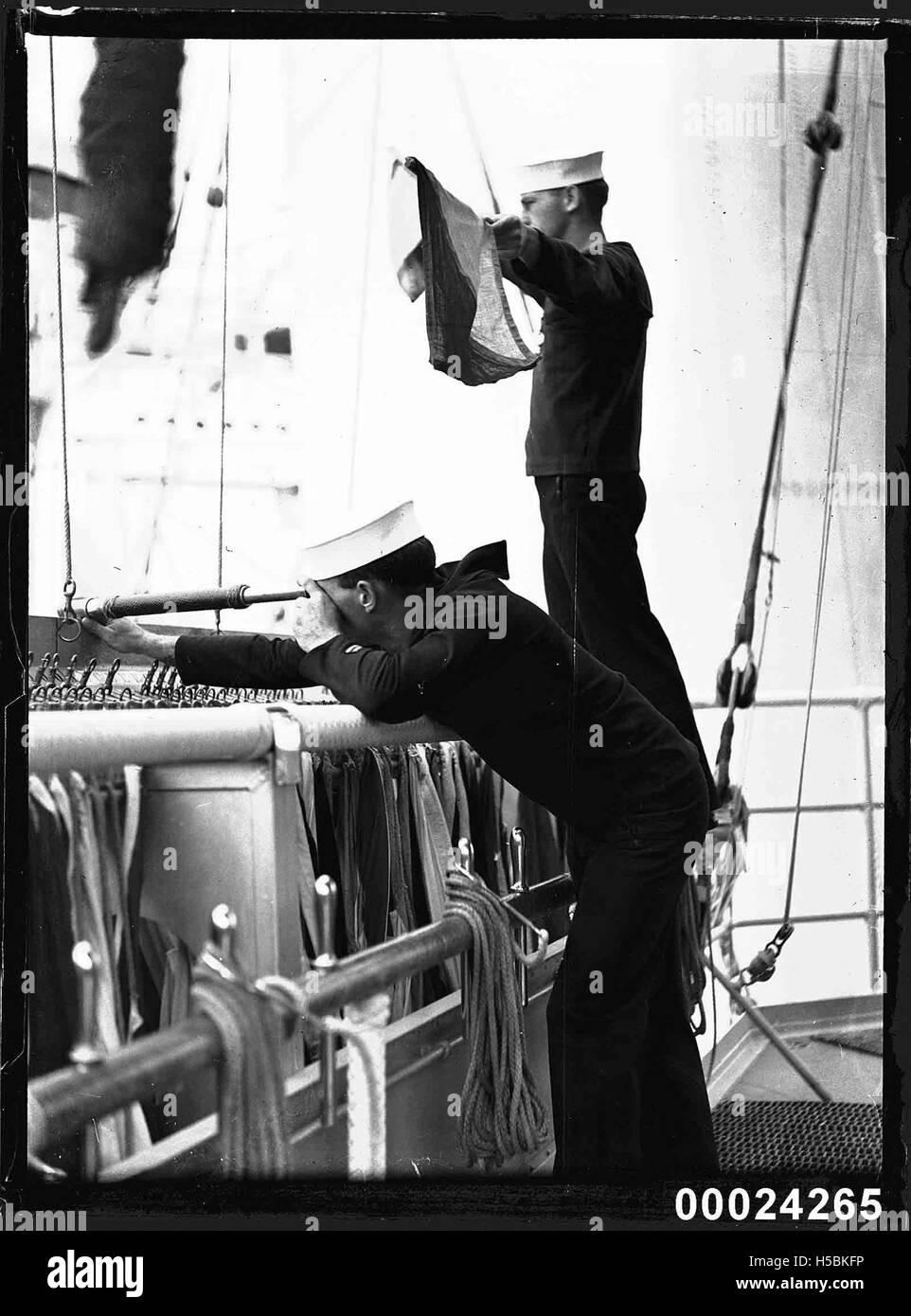 A photograph of United States Navy sailors on board the USS Astoria, a ...