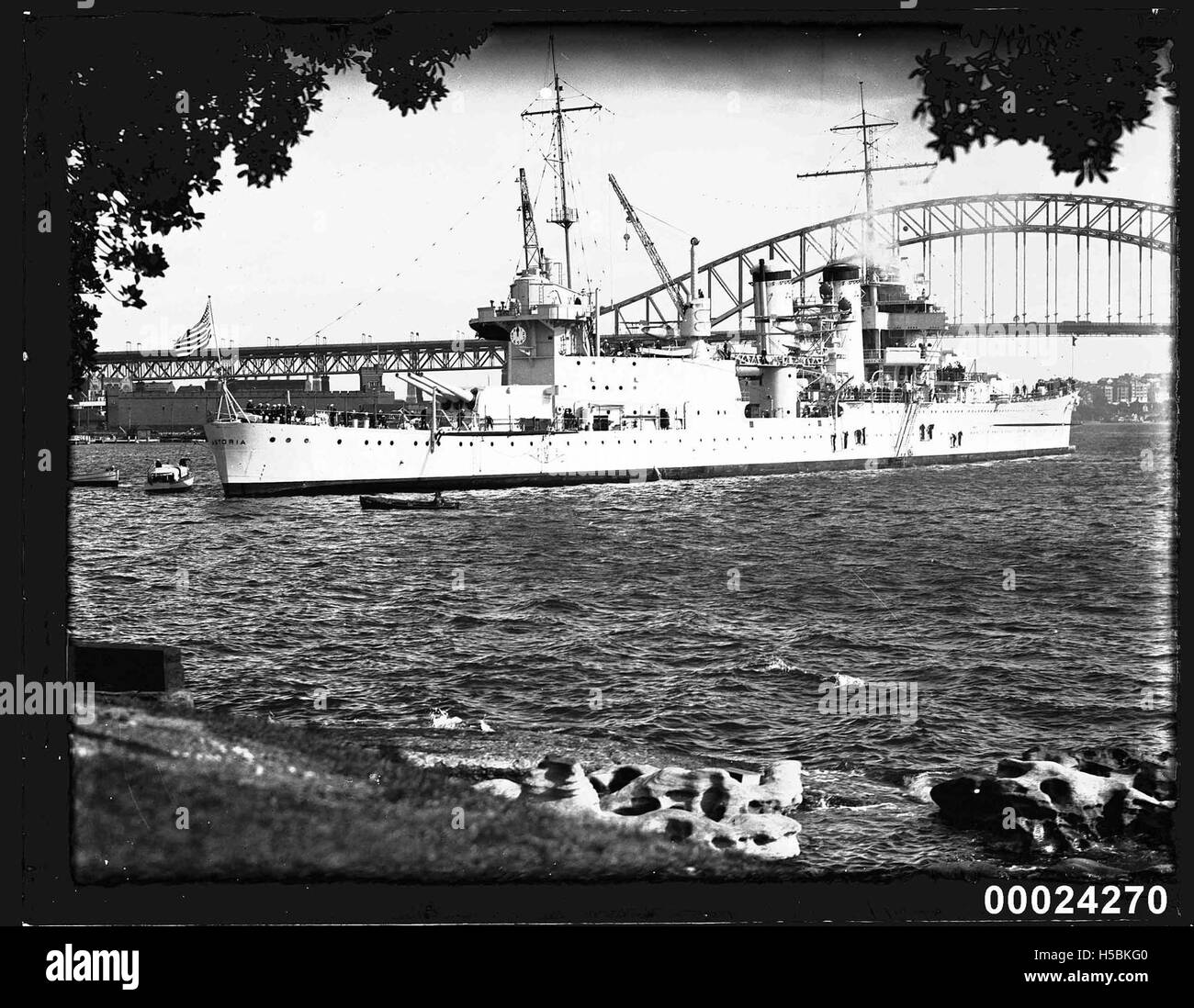 The USS Astoria, an American cruiser, is shown anchored in Farm Cove ...