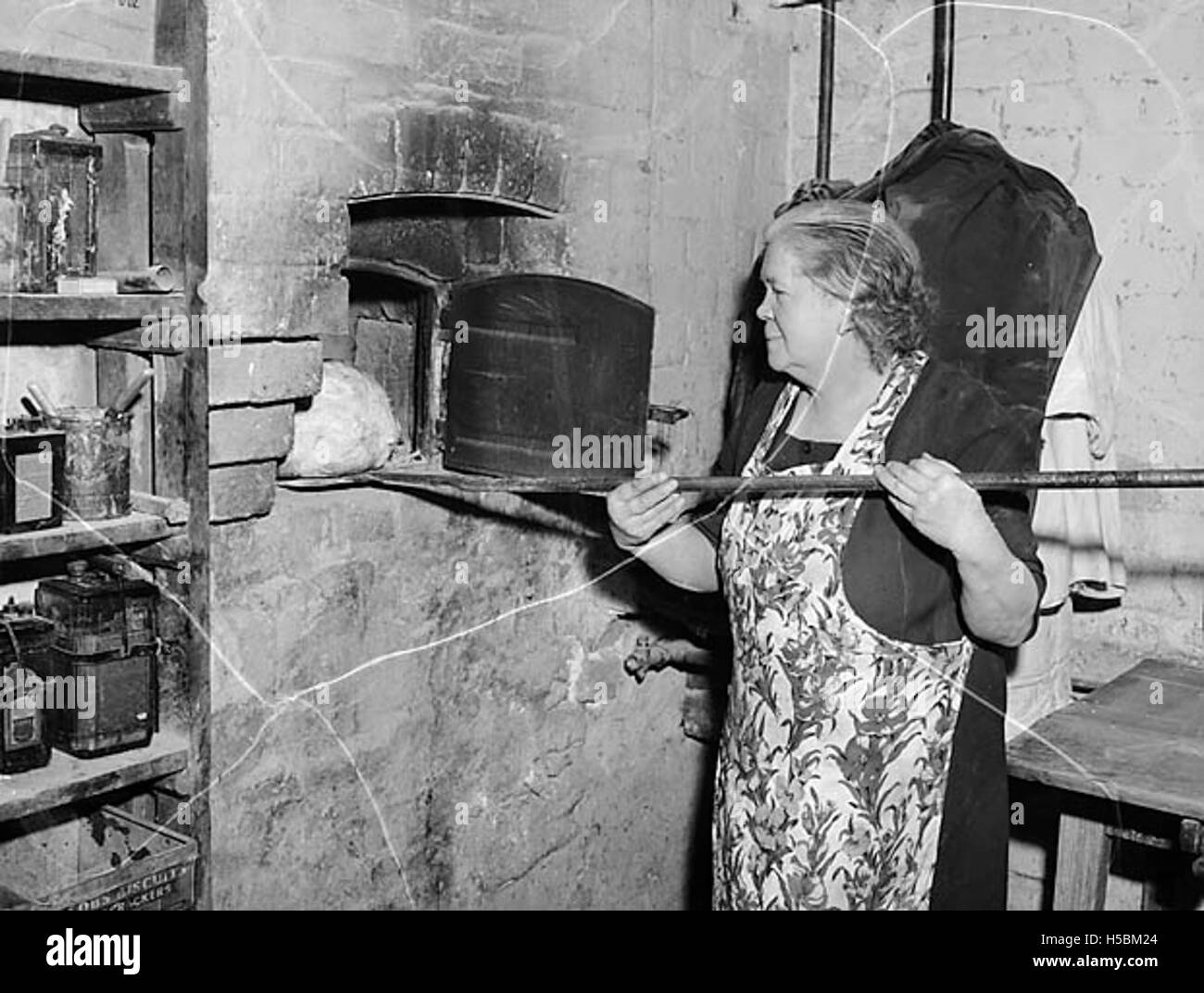 Cottage loaves being baked in an ancient oven in Llanrhaeadr-ym ...