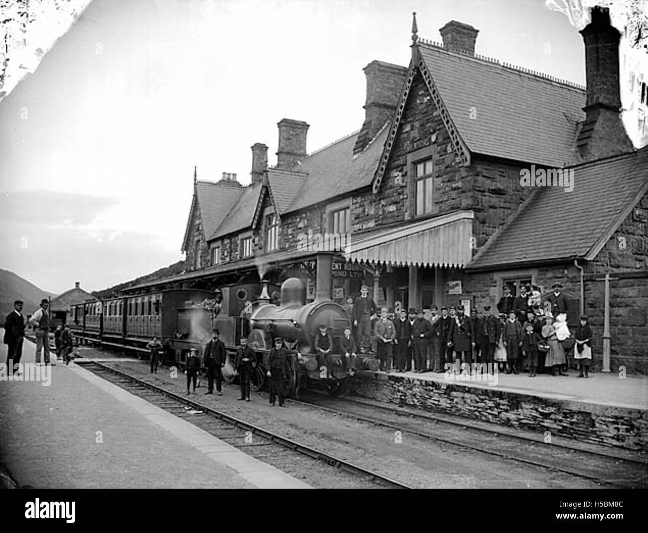 A black-and-white photograph of Machynlleth Railway Station, located in ...