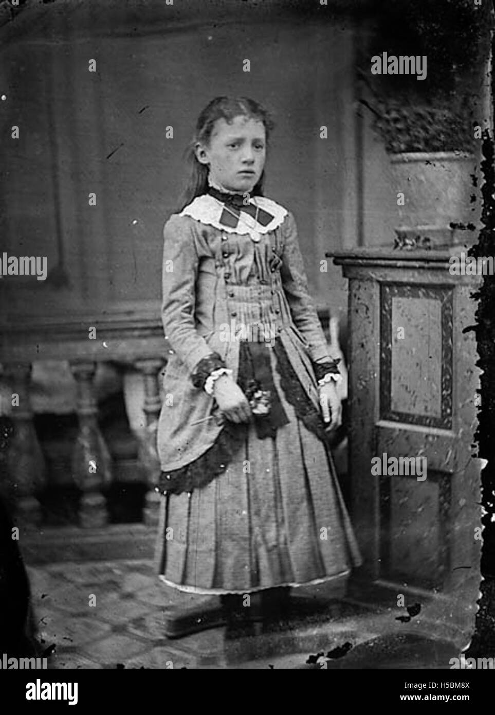 A girl is shown holding a flower, symbolizing innocence, nature, and a ...