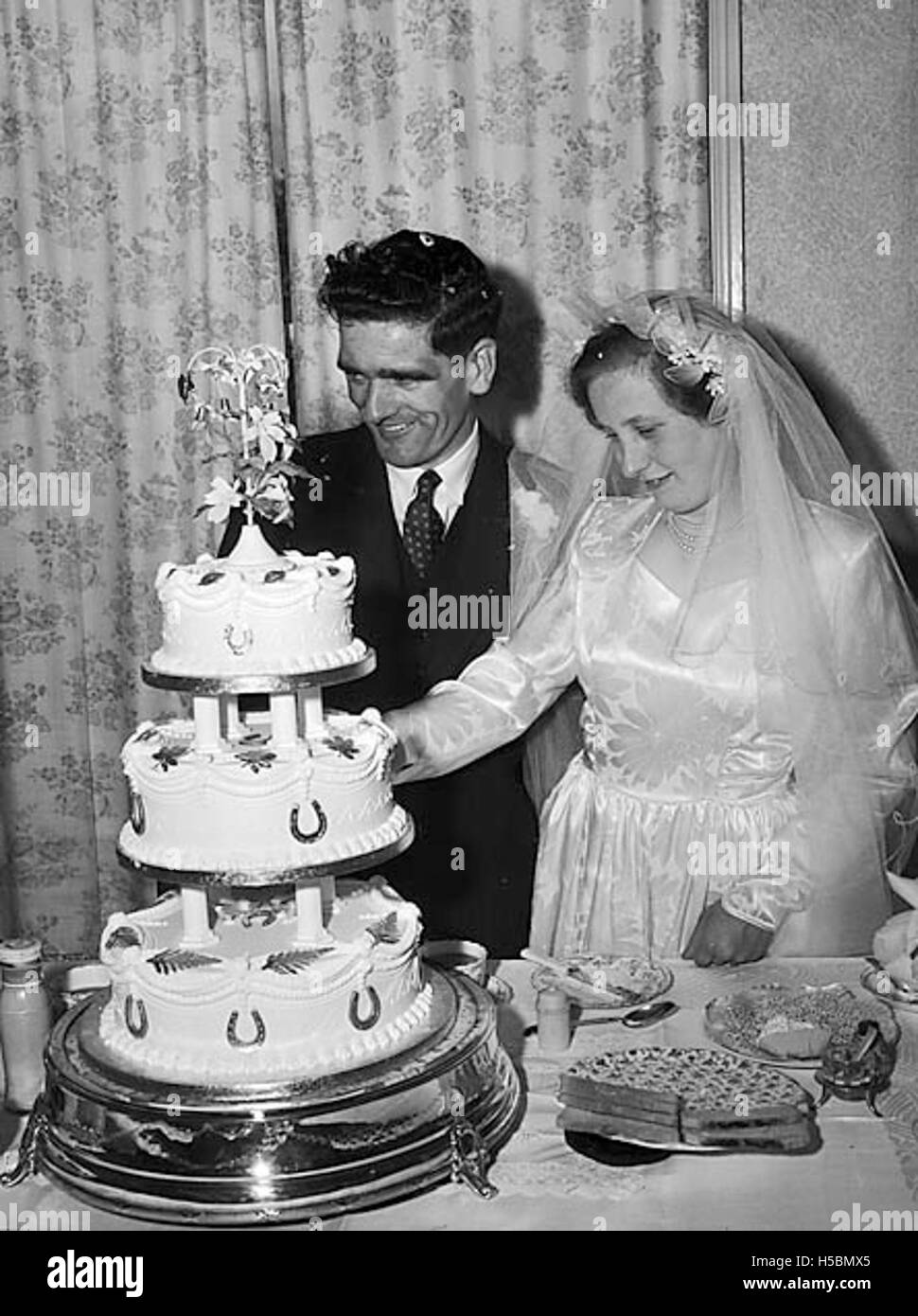 The wedding of Beryl Olwen Smith and Harry Evans, capturing a ...