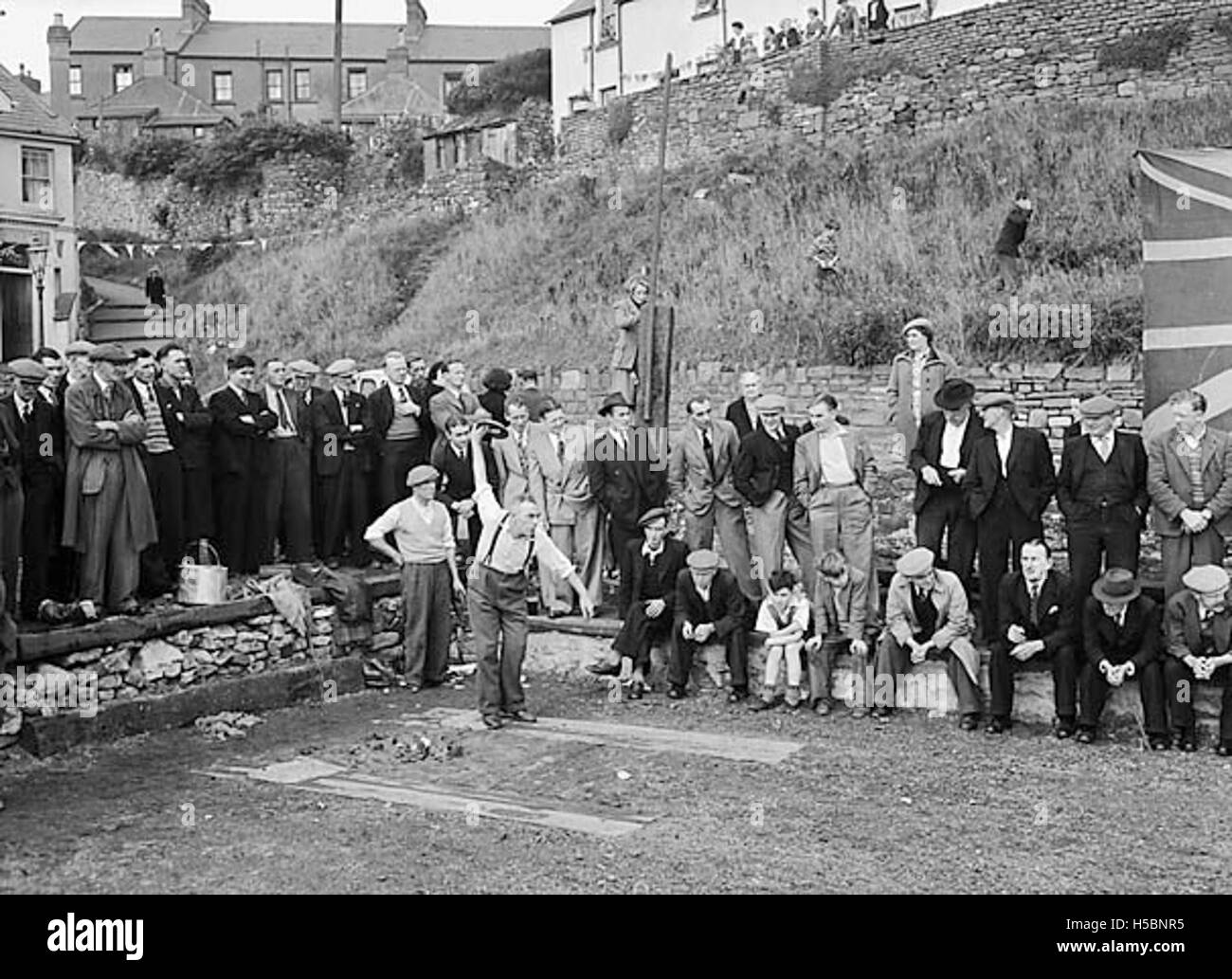 A historical photograph documenting the revival of the game of quoits ...