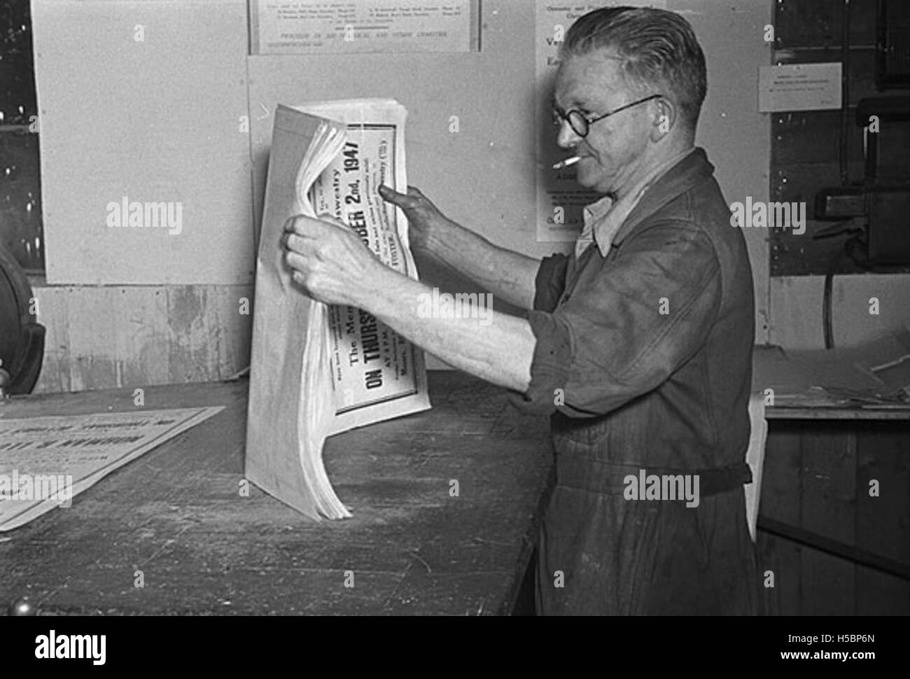 This image depicts a compositor or printer at work, likely during the ...