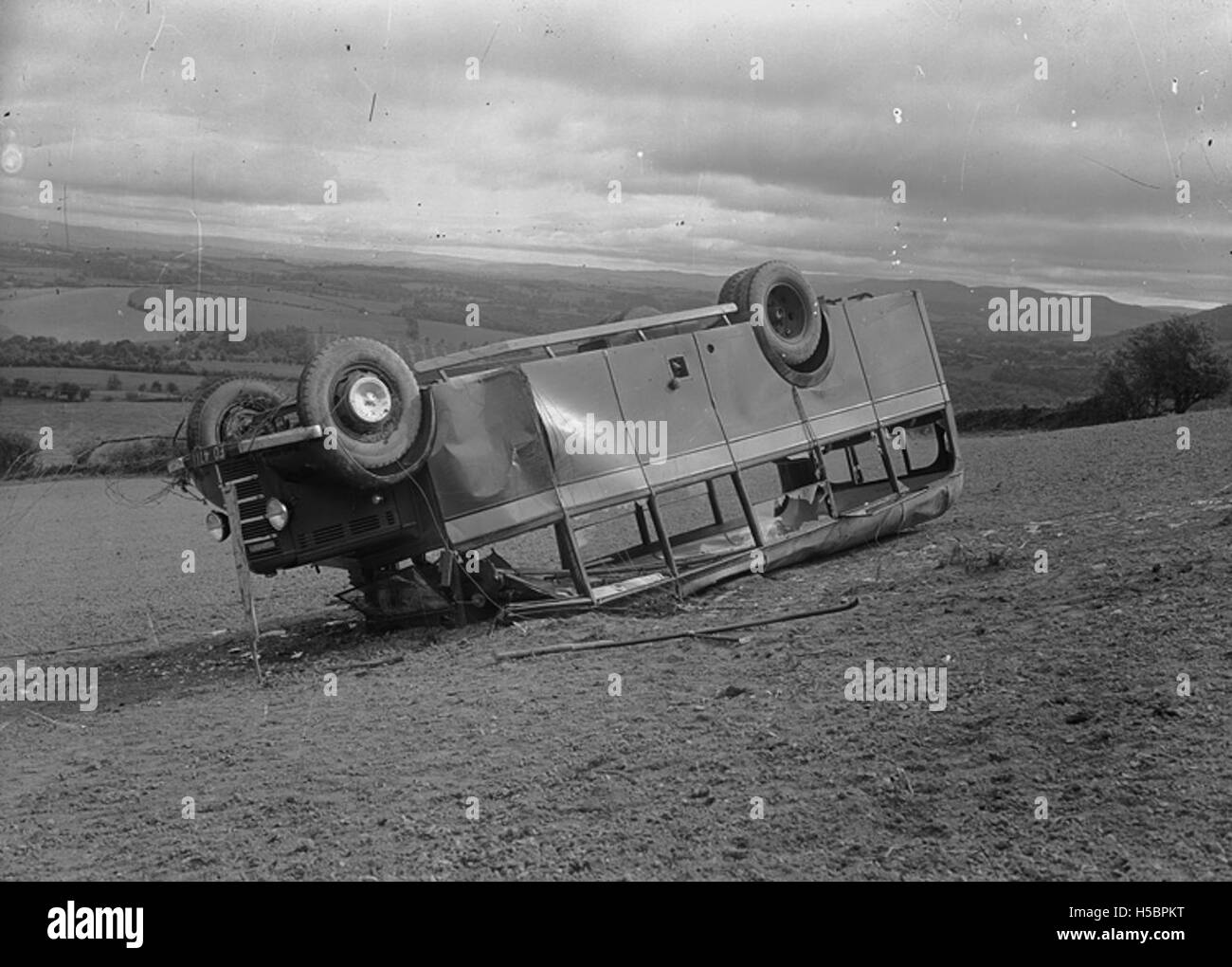 A historical photograph documenting a coach accident, showing the ...