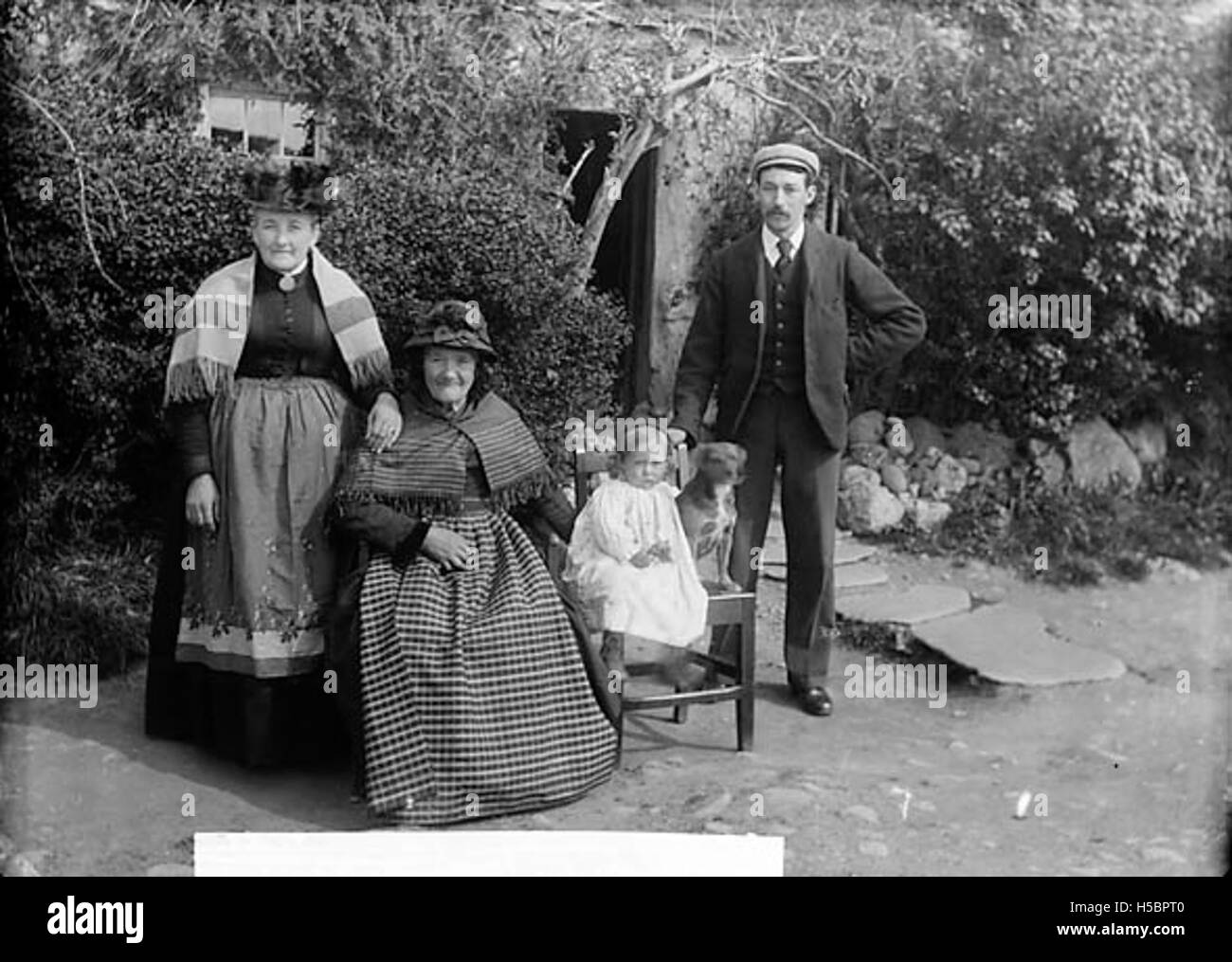This photograph captures four generations of a family along with their ...