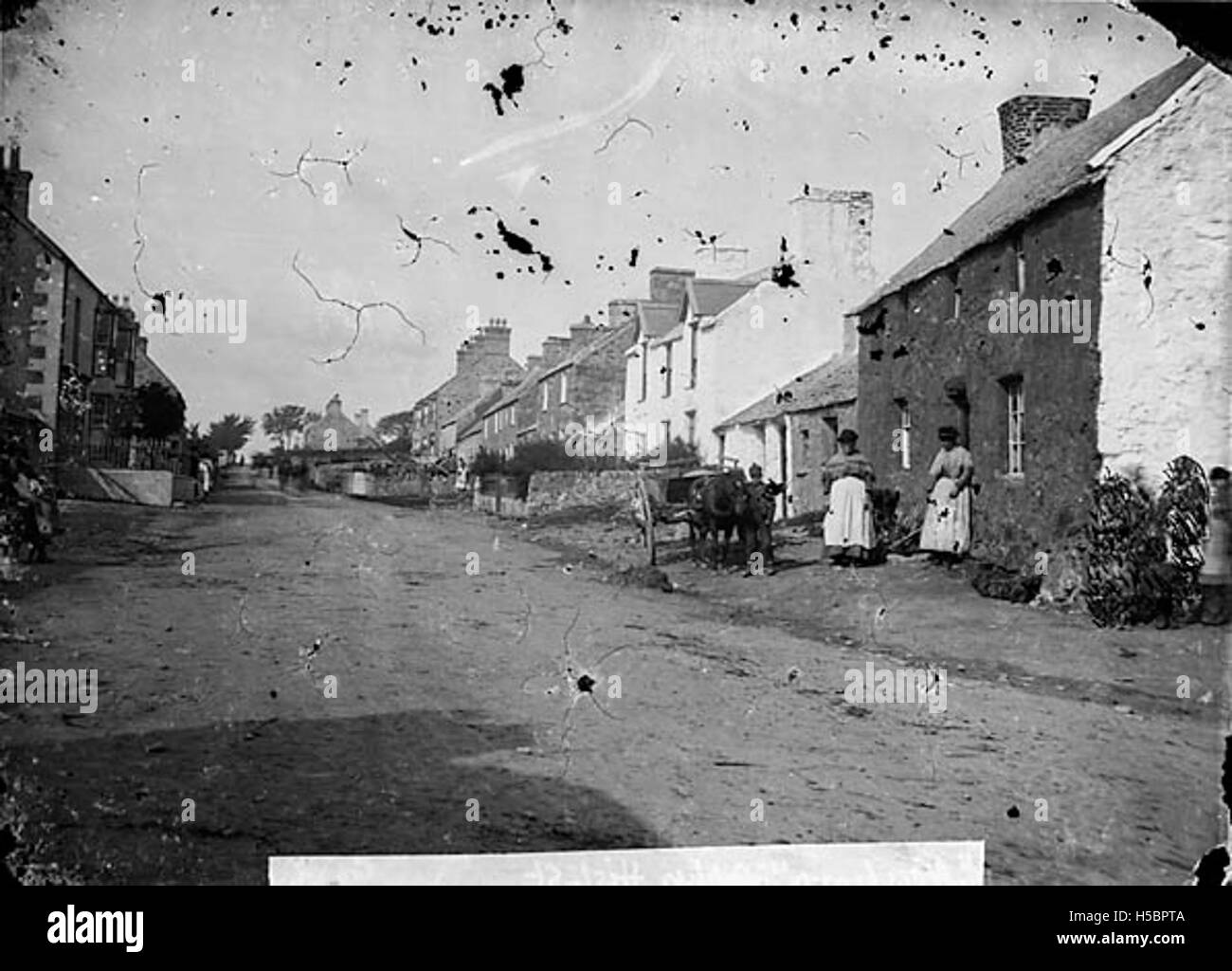 This photograph shows the upper High Street in Niwbwrch, a town on ...