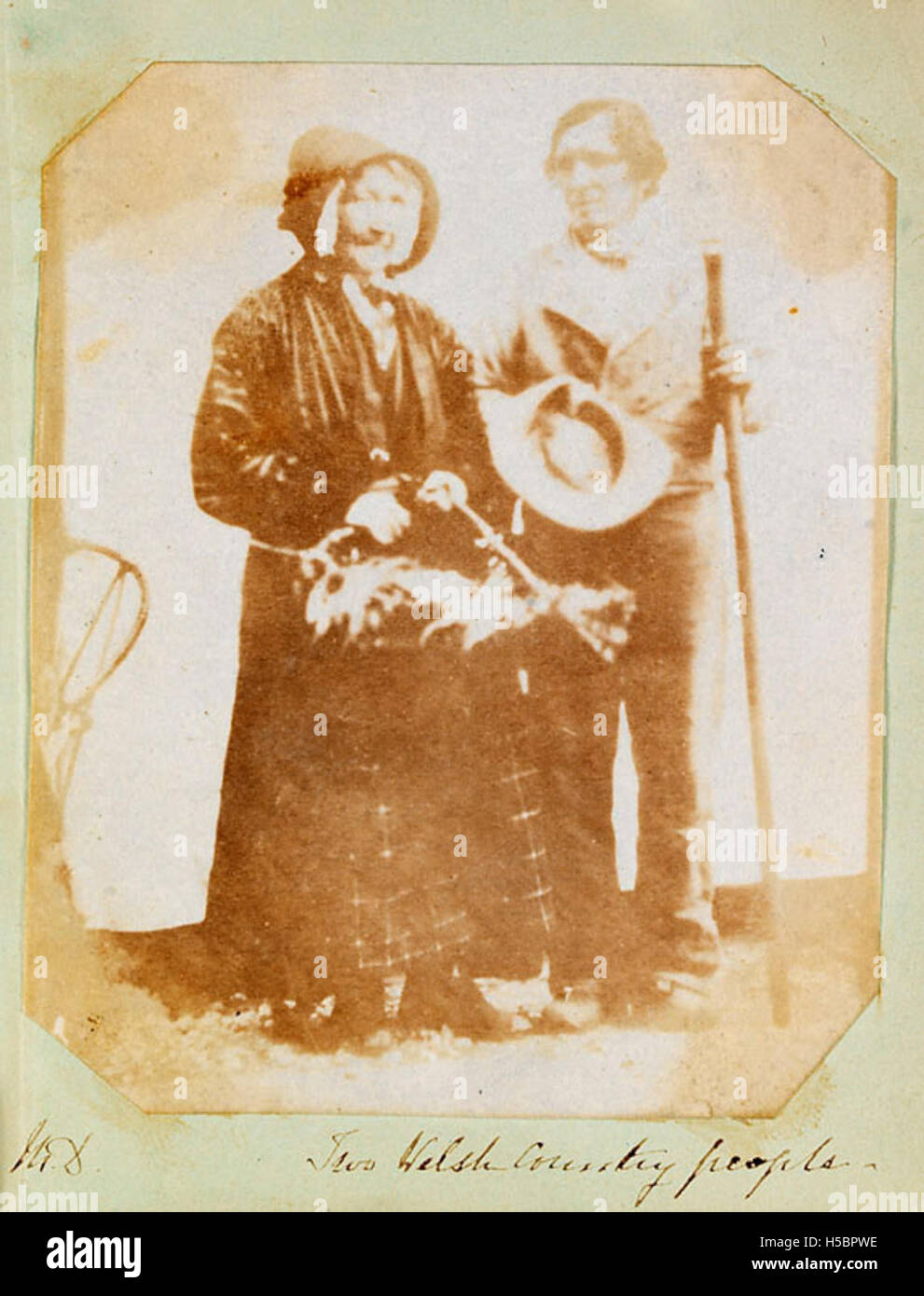 The photograph depicts two Welsh country people, likely from the rural ...