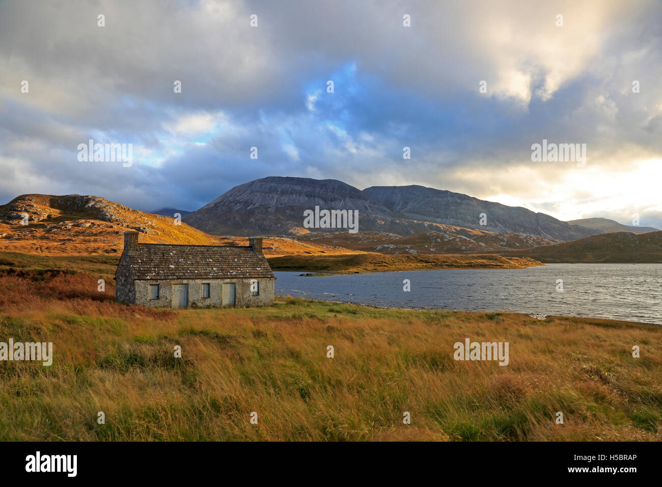 Derelict cottage by the side of Loch Stack with Arkle in the background ...